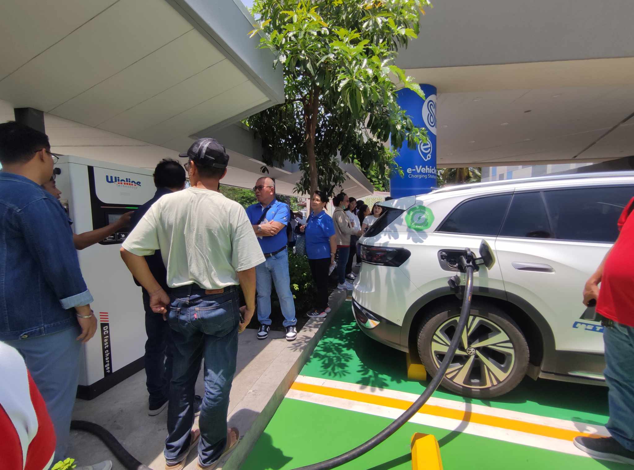 SM City Bataan’s free E-vehicle charging station passes DENR’s ...
